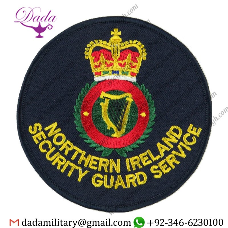 NORTHERN IRELAND SECURITY GUARD SERVICE CIRCULAR BADGE QUEENS CROWN UK